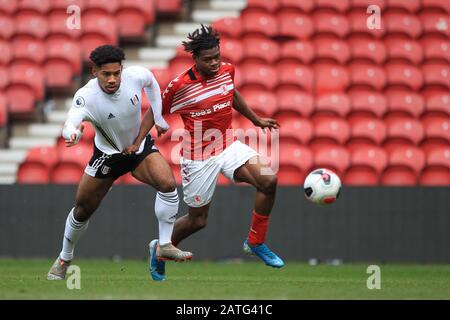 Sam Folarin of Middlesbrough battles with Fulham's Zico Asare during ...