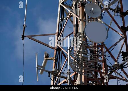Broadcasting big antenna on blue sky background Stock Photo - Alamy