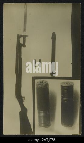 Description: Rifle with bayonet and used bullet casings Date: {1914 ...