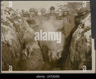 The western front. How Tommy is fed Description: Tommies eating in a ...
