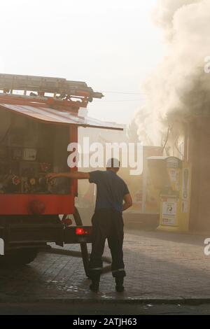 The real work of firefighters at the scene. Extinguishing a burning ...