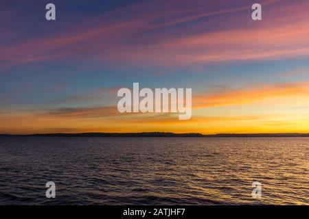 Many colors fill the sky as the sun set over the Puget Sound Stock ...