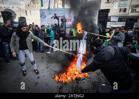 Protesters burn U.S. flags during a protest in front of Trump Tower on ...