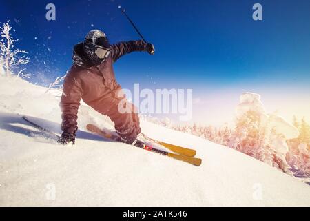 Skier skiing downhill during sunny day in high mountains, Kaprun glacier- Zell am see, Austria ...