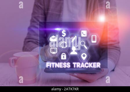 Handwriting text Fitness Tracker. Concept meaning device that records a ...
