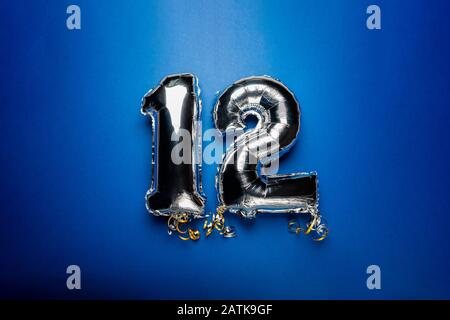 Number 12 blue foil helium balloon isolated on a white background. 3D ...