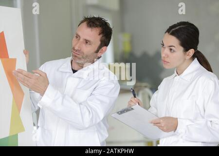 construction worker puts a finishing touch on the wall Stock Photo - Alamy