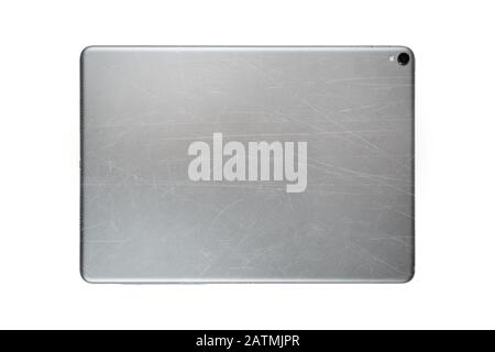 Scratched back side of tablet isolated on white background Stock Photo ...