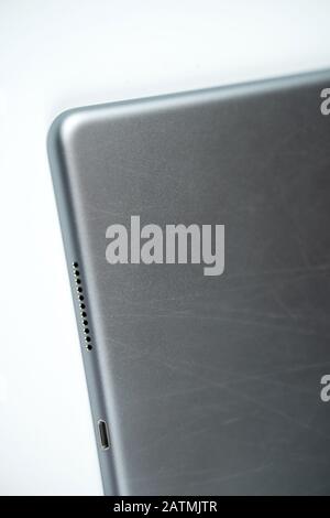Scratched back side of tablet isolated on white background Stock Photo ...