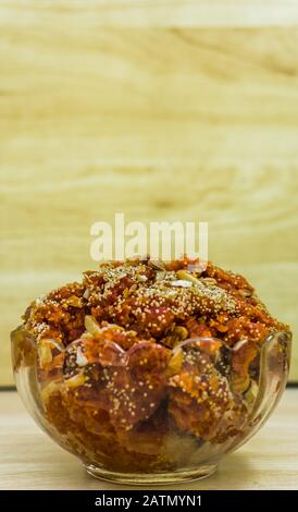 Bowl with delicious poppy seed pudding and plate with strawberries and ...