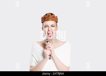 Portrait of woman singer on gradient studio background in neon with ...