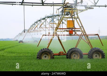 Irrigation system on wheels on the field Stock Photo - Alamy