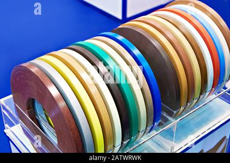 Colored plastic films for the end face of furniture panels Stock Photo ...
