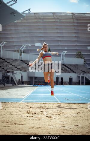 athlete doing long jump Stock Photo - Alamy