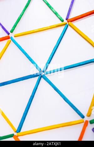 Geometric figures triangles formed with colorful sticks Stock Photo - Alamy