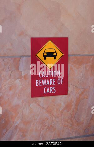 Beware of cars sign Stock Photo - Alamy