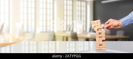 Businessman hand holding wooden cube block with POWER business word on ...