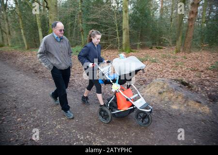 teenage mum pushing buggy in run down derelict area Stock Photo - Alamy