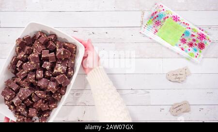 Flat lay. Step by step. Packaging homemade fudge and cookies into a ...