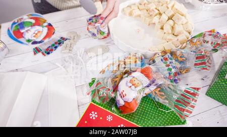 Step by step. Packaging homemade fudge and cookies into a Christmas ...
