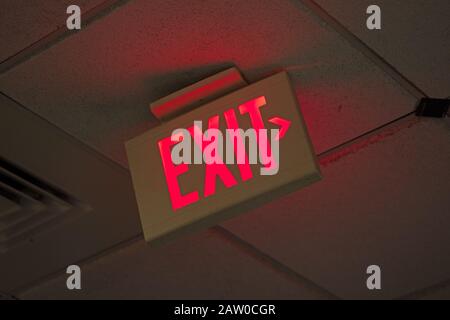 Red Exit Sign on Ceiling Stock Photo - Alamy