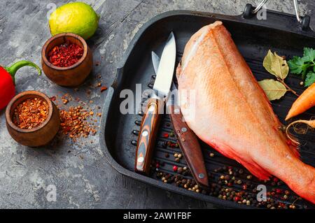 Whole raw fresh red perch or seabass.Raw fish seabass on wooden ...