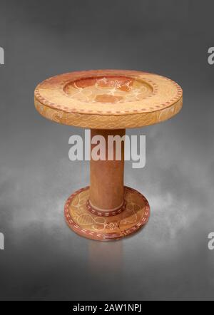 Minoan clay round offering table with a high base and large cup with a ...