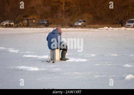 Winter fishing, ice fishing. Vladivostok, Russia Stock Photo - Alamy