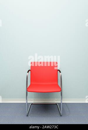 Interview, empty chair and waiting room by wall background in office ...