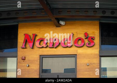 Nando's sign and logo above the restaurant in Clink Street, London ...