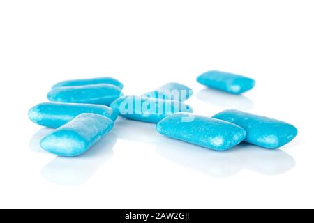 Lot of whole blue chewing gum in bamboo bowl isolated on white ...