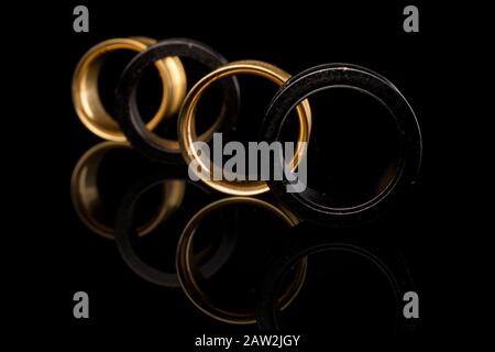 Group of four whole plug diagonal isolated on black glass Stock Photo ...