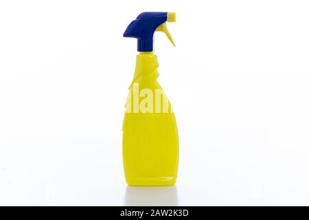 Yellow bottle for detergent with a sprayer. It is isolated the worker ...
