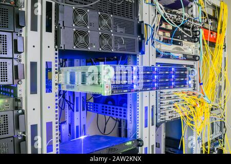 Modern servers are installed in the racks of the server room of the ...