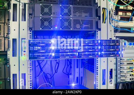 A modern set of computer equipment is installed in the data center ...
