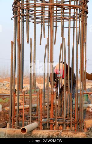 Bridge construction under performing the steel reinforcement of piling ...