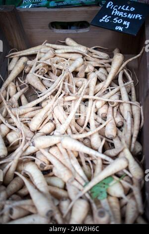 Piccolo parsnips for sale on a counter in Borough Market Stock Photo ...