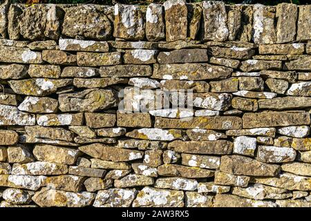 An old limestone stone wall with layers and cracks Stock Photo - Alamy