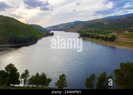 The king Talal Dam is a large and beautiful dam in the hills of ...