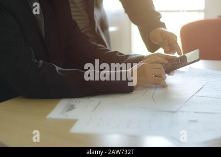 Business people, hands and marketing documents in meeting in office ...