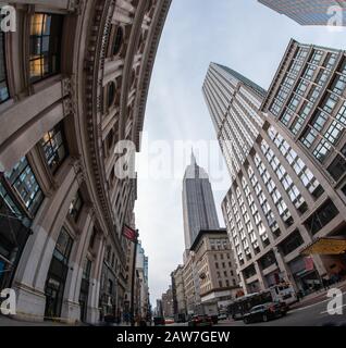 A vertical low-angle shot of the Empire State Building in New York ...