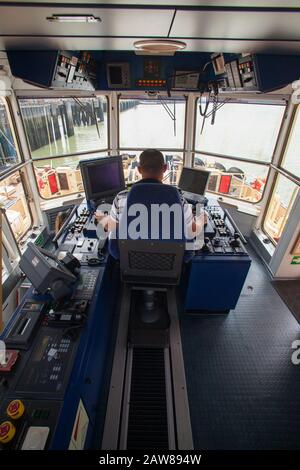 Tug boat captain cockpit tugboat operator driver pilot cab Stock Photo ...