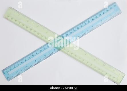 colorful plastic ruler crossing on white background Stock Photo - Alamy