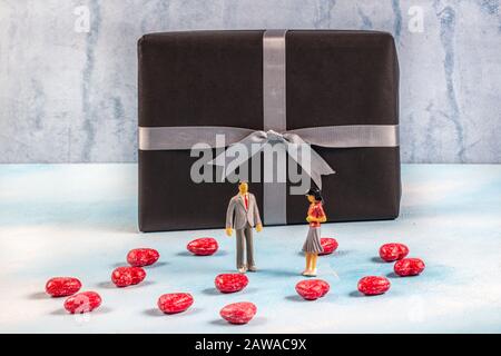 Olive soap bar, candles, massage brush and tree branch on white ...