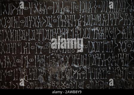 Engraved ancient stonewiht Old Alphabet letters writting from antique ...