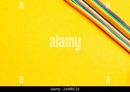 Colorful wires isolated on yellow background. connection wire for ...