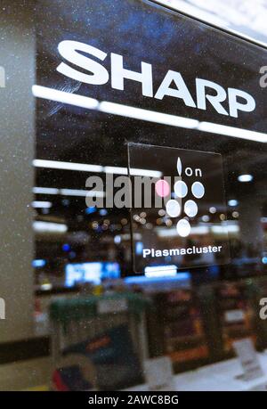 logotype of the Sharp corp, placed on storefront Stock Photo - Alamy