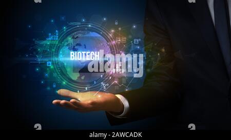 Elegant hand holding BIOTECH inscription, digital technology concept ...