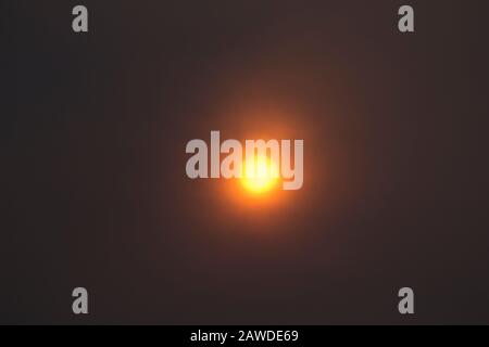 Red Sun Caused by Distant Wildfires Stock Photo - Alamy