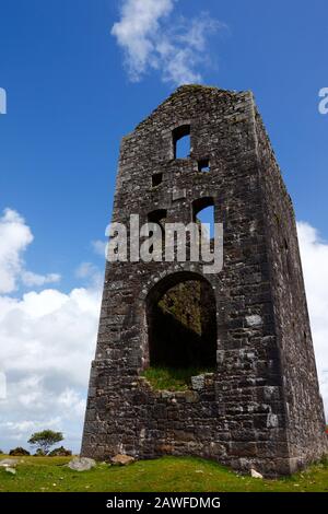View from mine shaft looking up into wooden head frame structure above ...